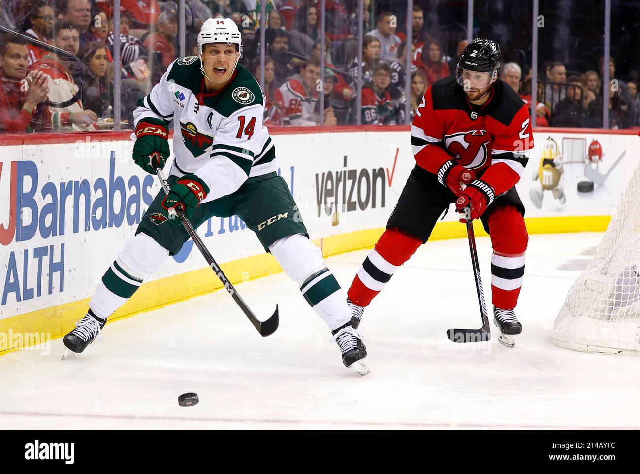 Minnesota Wild center Joel Eriksson Ek (14) passes the puck against New ...