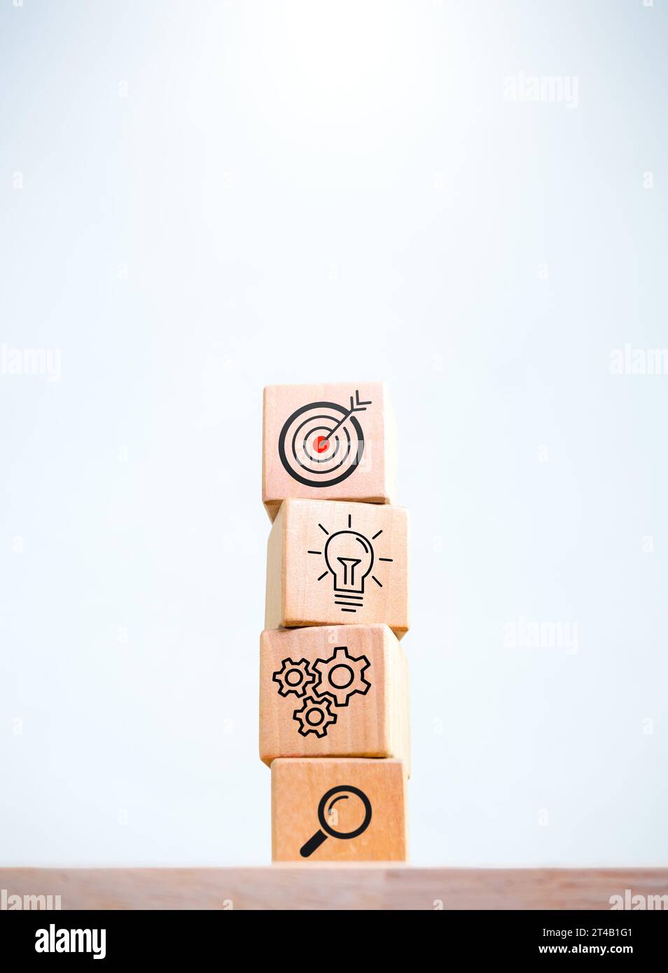 Business strategy and action plan icon on four wooden cube blocks stack ...