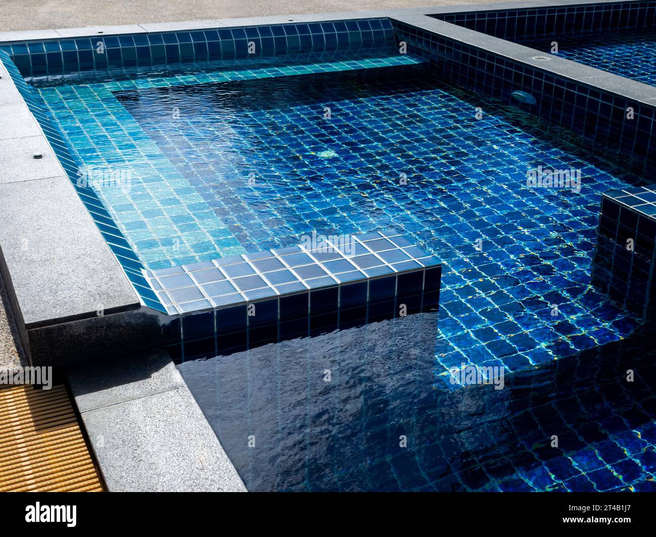 Floating bench seat, sitting zone in swimming pool with clean clear ...