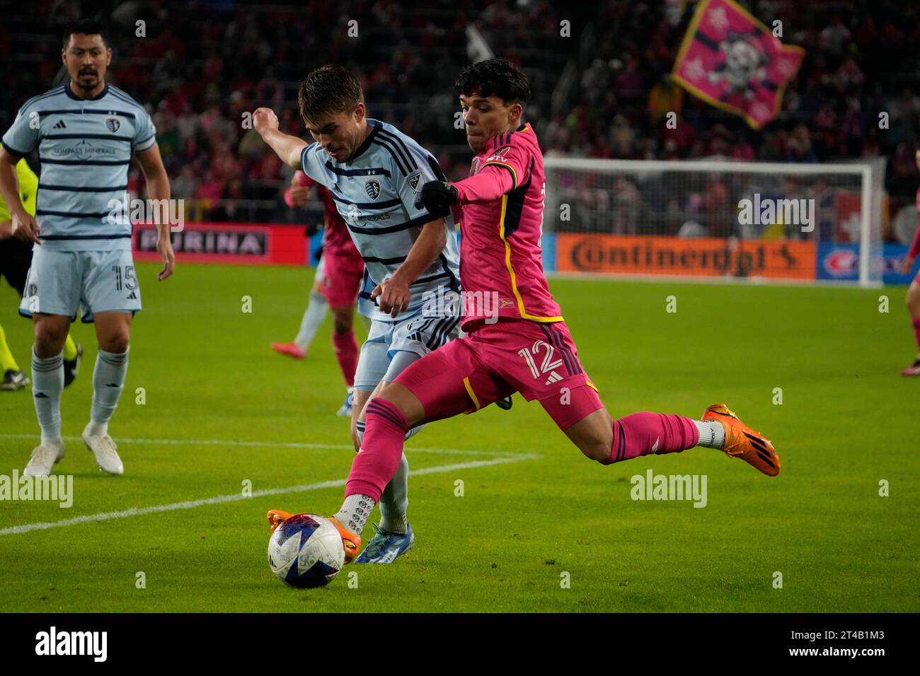 St. Louis City's Celio Pompeu (12) and Sporting Kansas City's Jake ...