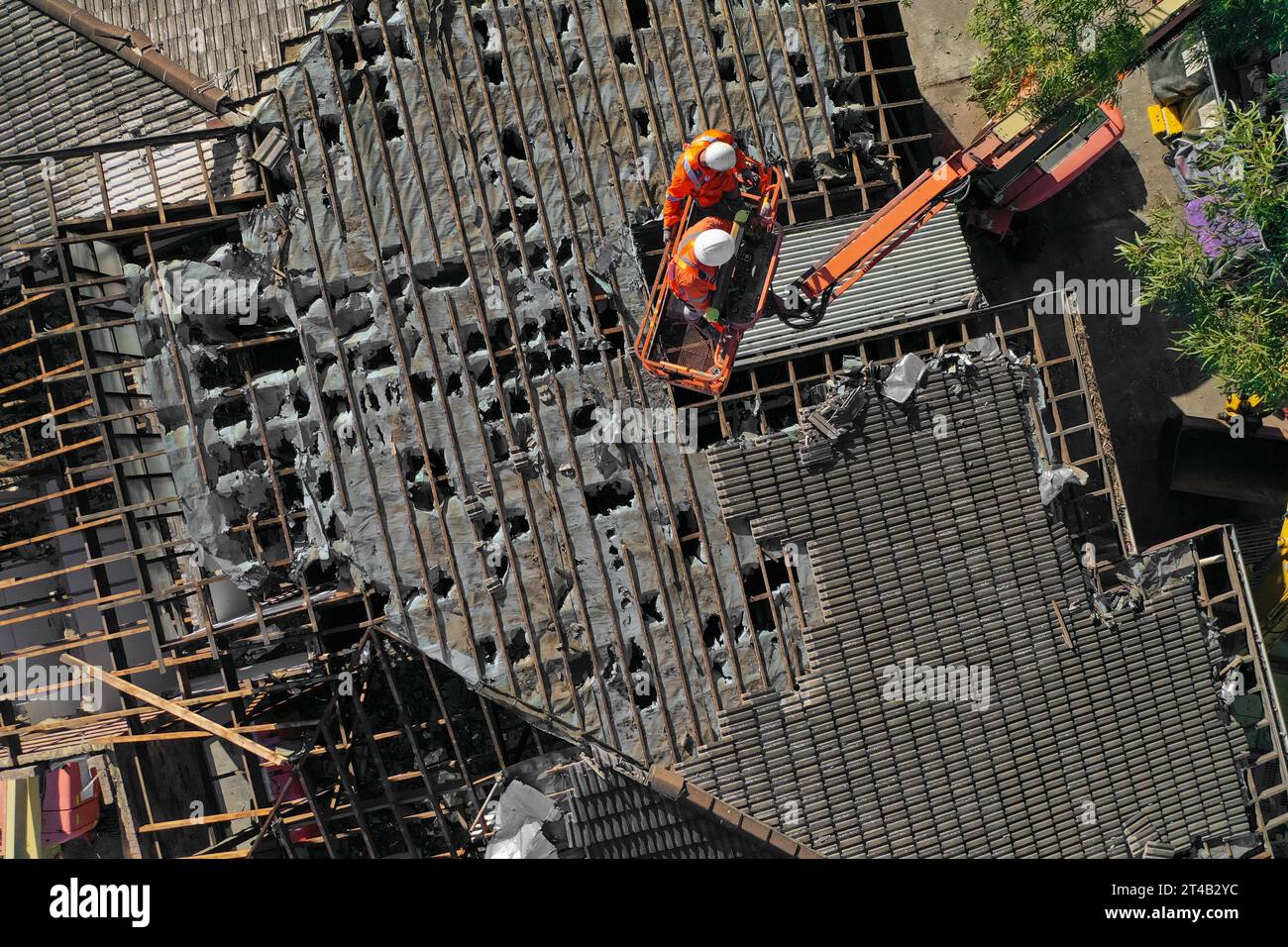 Aerial drone photo of demolition site and construction workers using ...