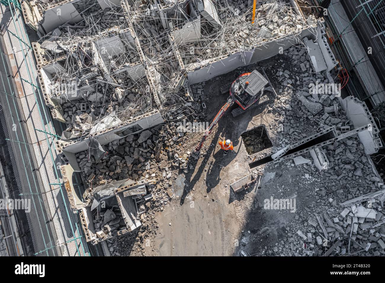 Aerial drone photo of demolition site and construction workers using ...