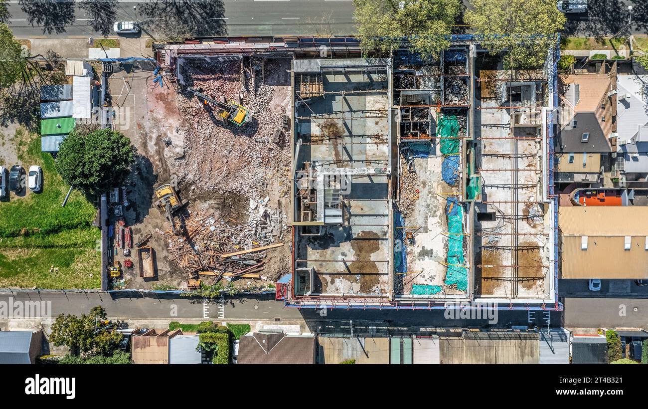 Aerial drone photo of demolition site and construction workers using ...