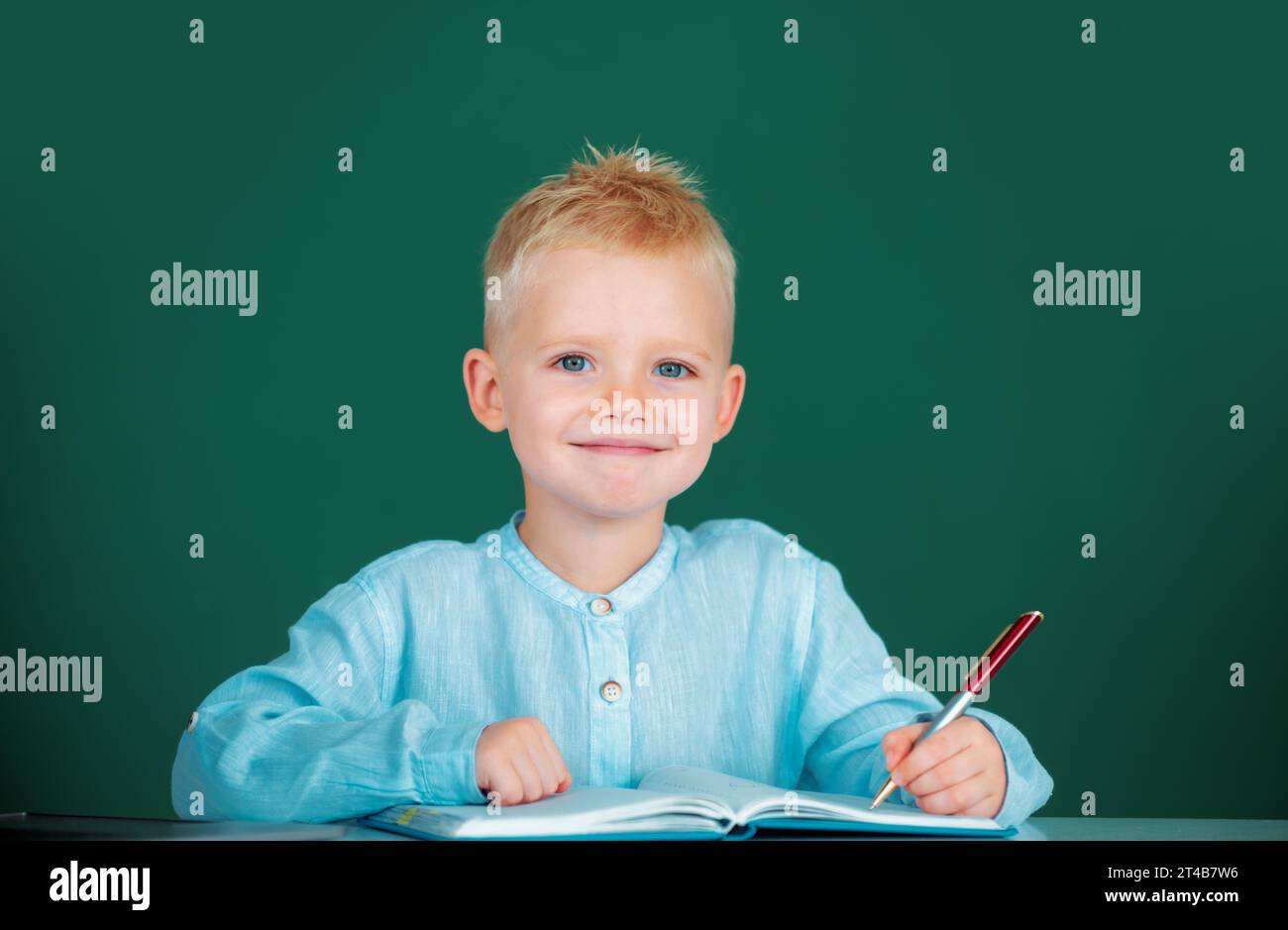Kid writing in class. School child student learning in class, study ...