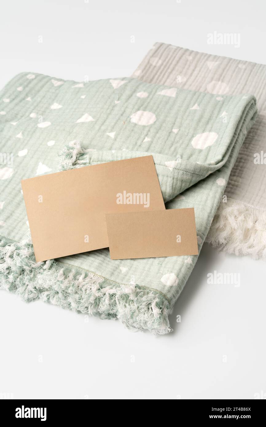 Warm cotton muslin blanket with paper tag on white background Stock ...
