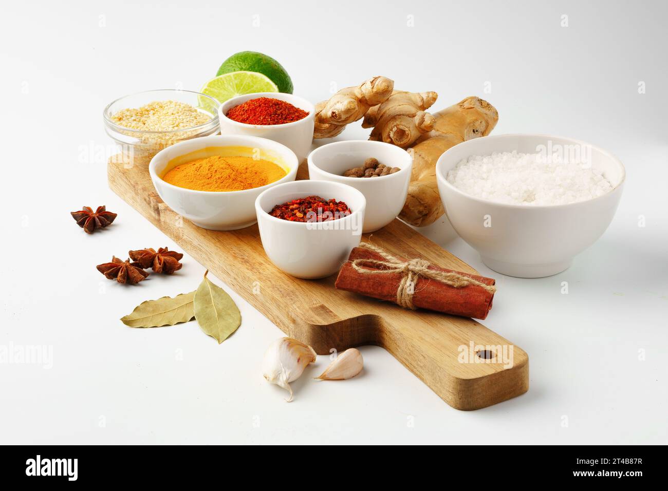 Ginger root and various spices on white background Stock Photo - Alamy
