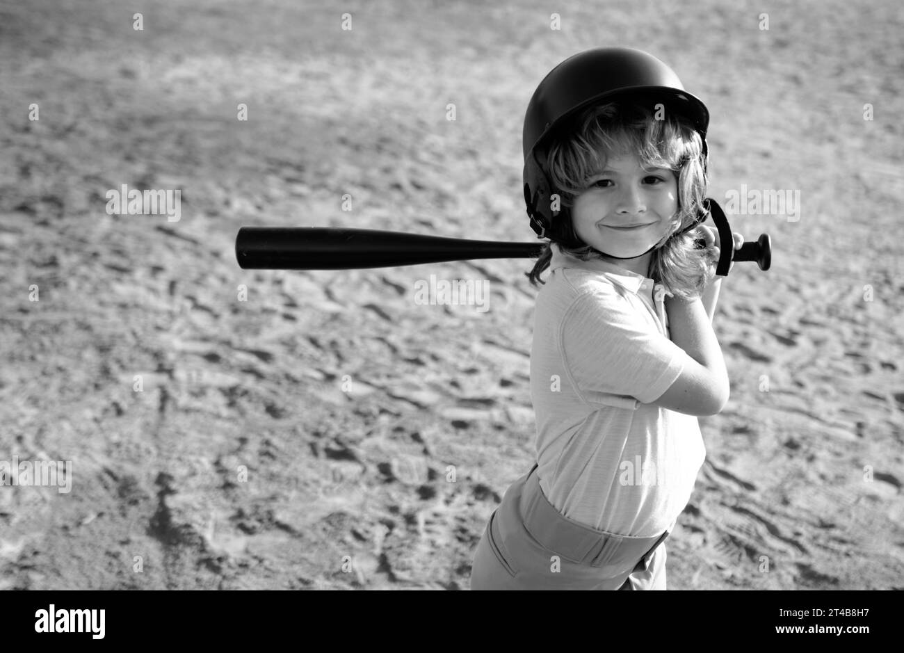 Boy in baseball helmet and baseball bat ready to bat Stock Photo - Alamy