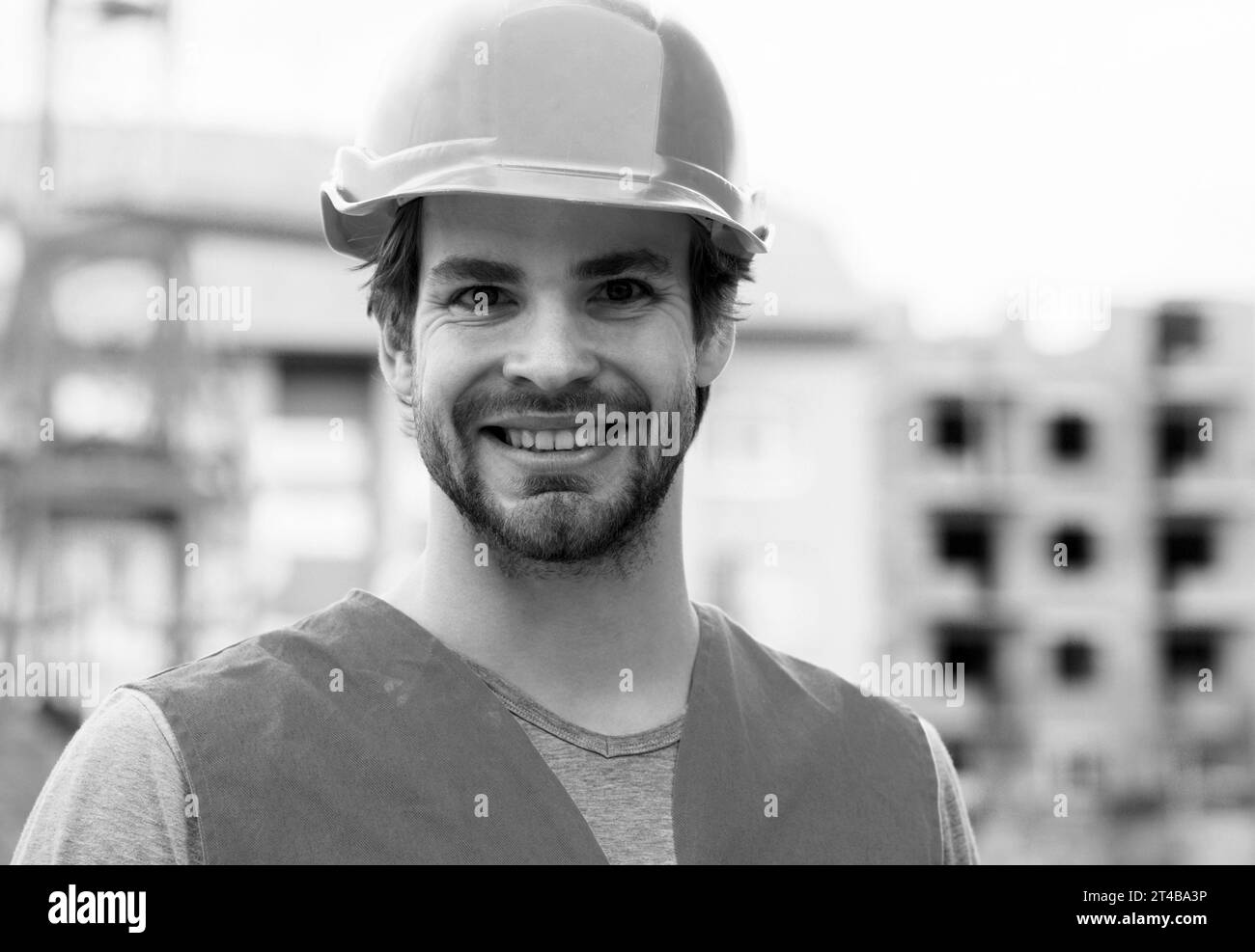 Construction worker man in work clothes and a construction helmet ...
