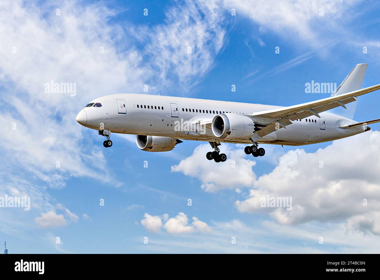 Boeing 787-8 Dreamliner passenger plane landing at the airport, under a ...