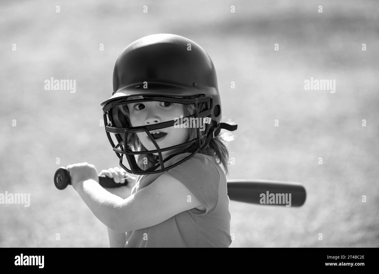 Baseball players kid swinging the bat at a fastball from the pitcher ...