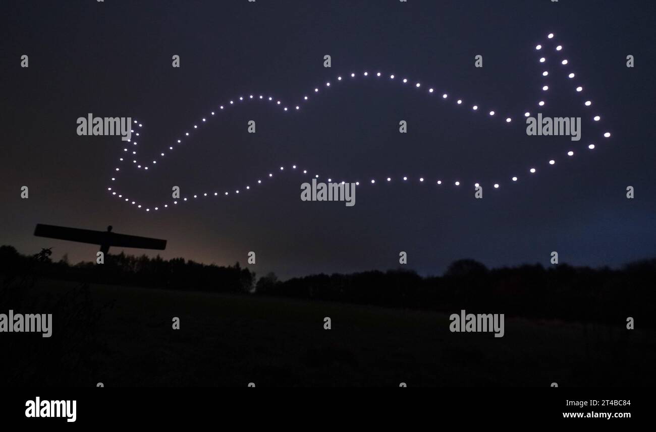 EDITORIAL USE ONLY A view of 100 drones in a 'Mo' formation in front of ...