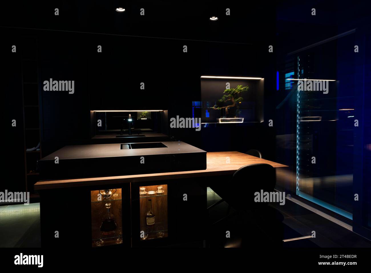 Illuminated Modern Design of a Luxury Kitchen with Reflection in ...