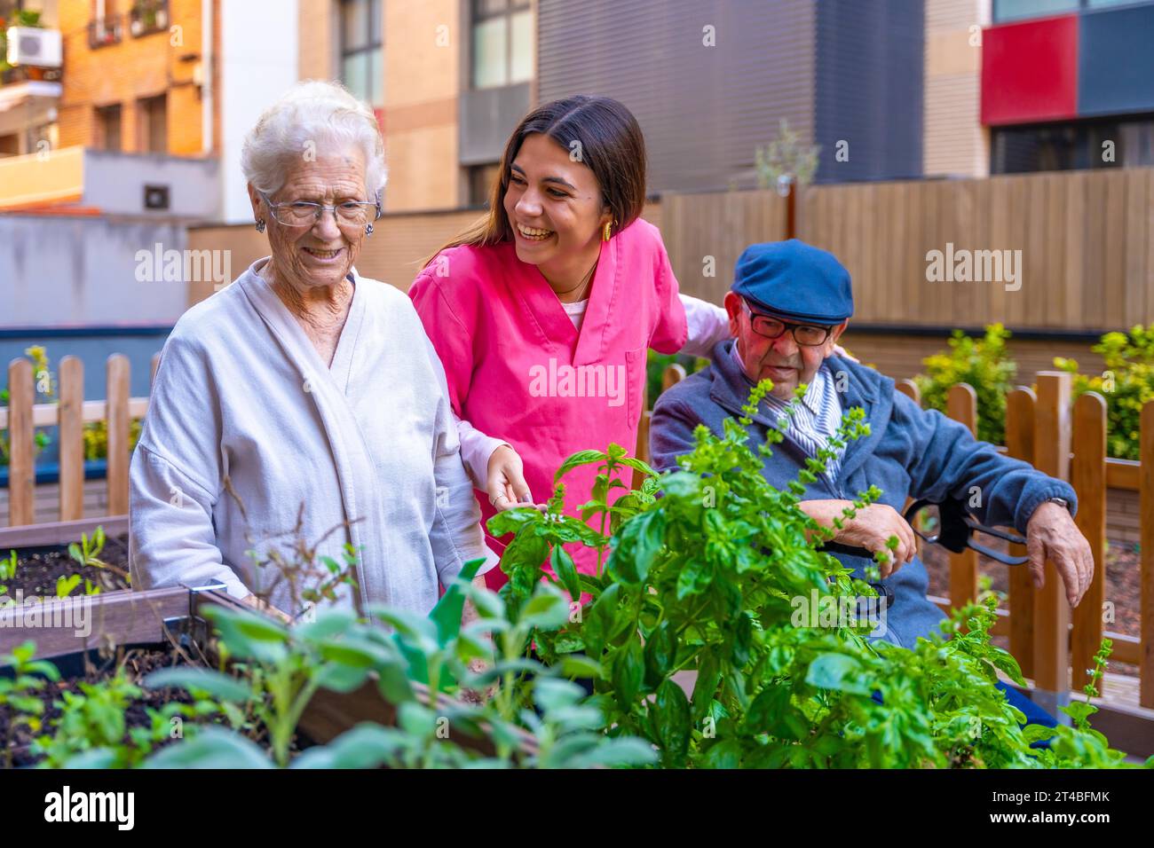 Nurse and elder people in an urban garden in a geriatric Stock Photo ...