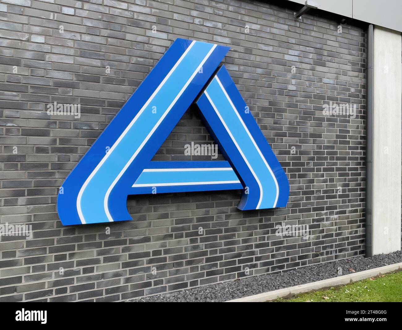 Perspective photo of logo A in blue without lettering on wall of ...