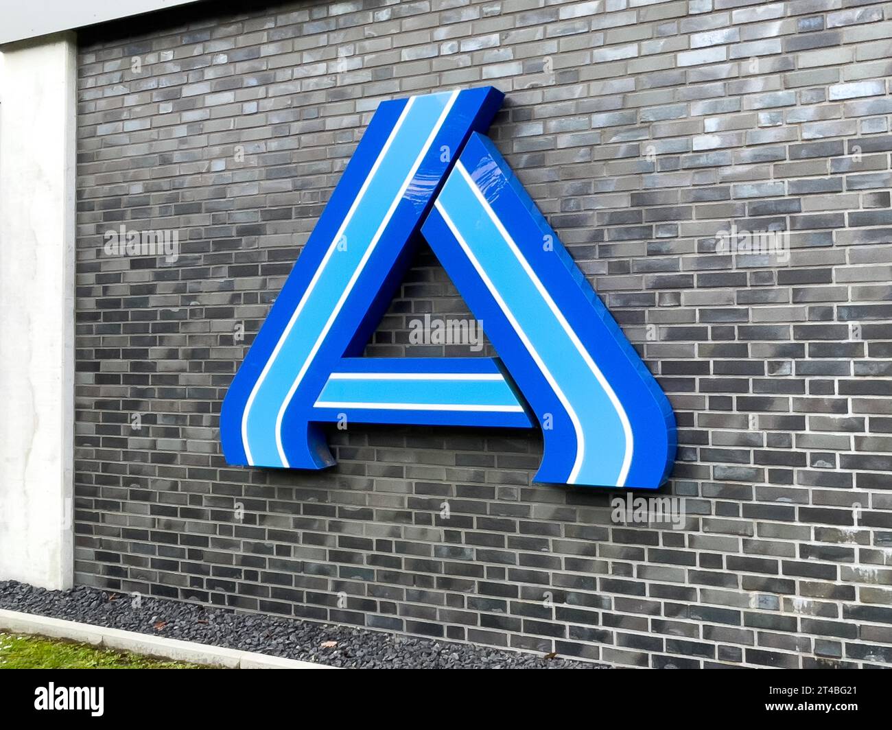 Perspective photo of logo A in blue without lettering on wall of ...