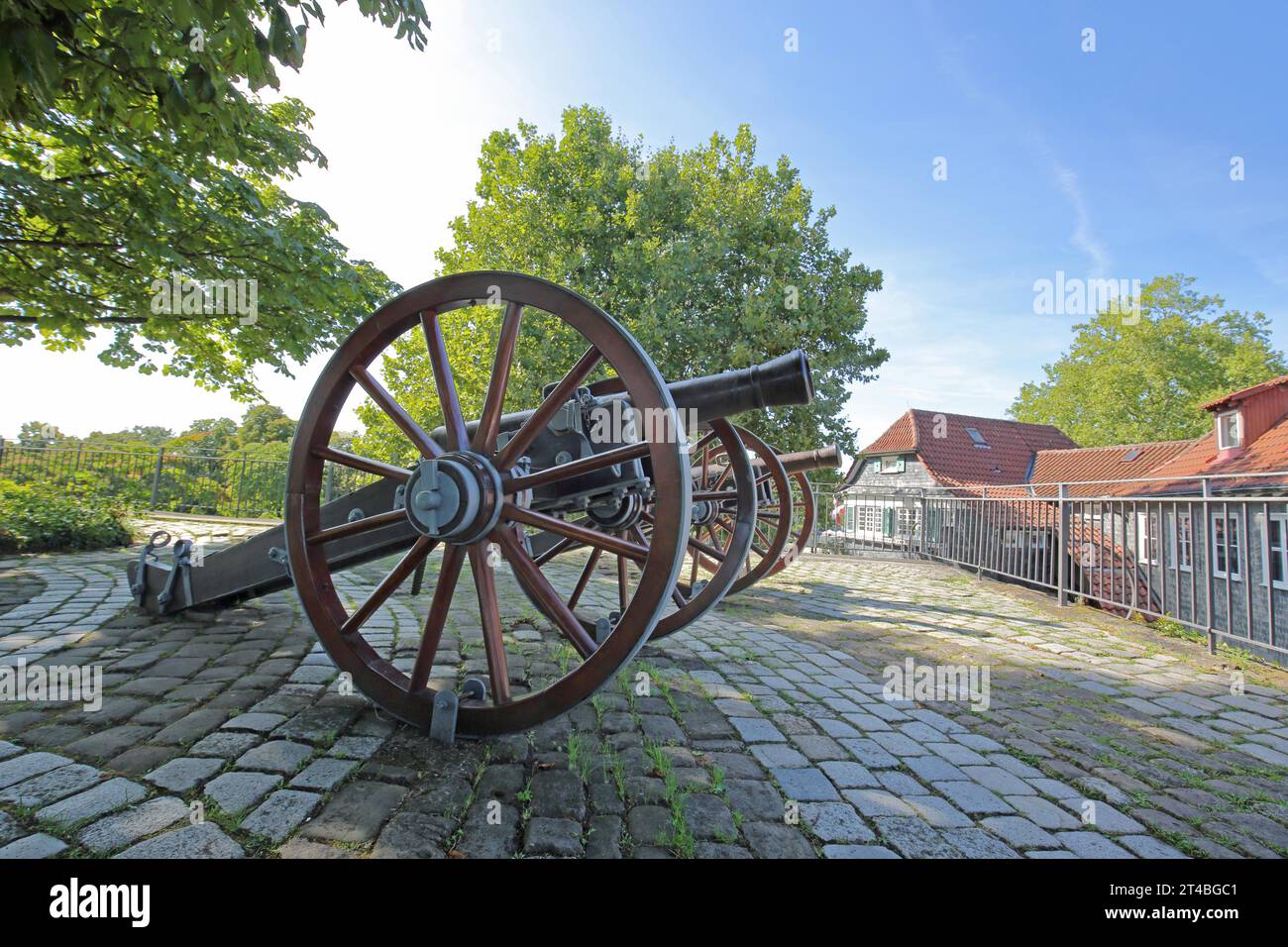 Two historic cannons with wagon wheels in the courtyard of the castle ...