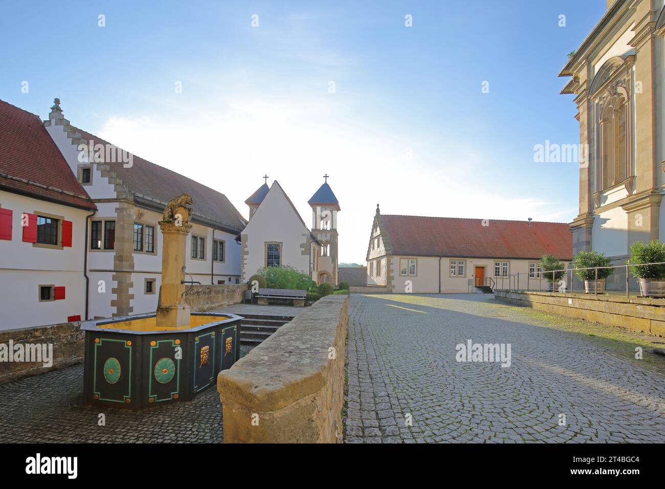 Inner courtyard with fountain of the Romanesque Comburg monastery ...
