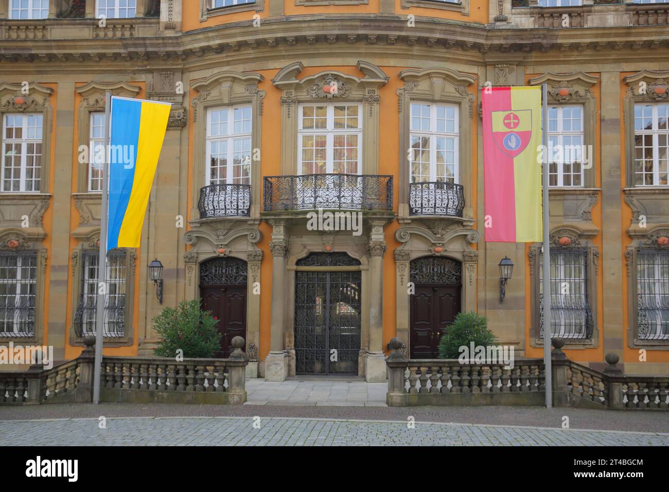 Baroque town hall built 1735 with Ukrainian national flag and town flag ...