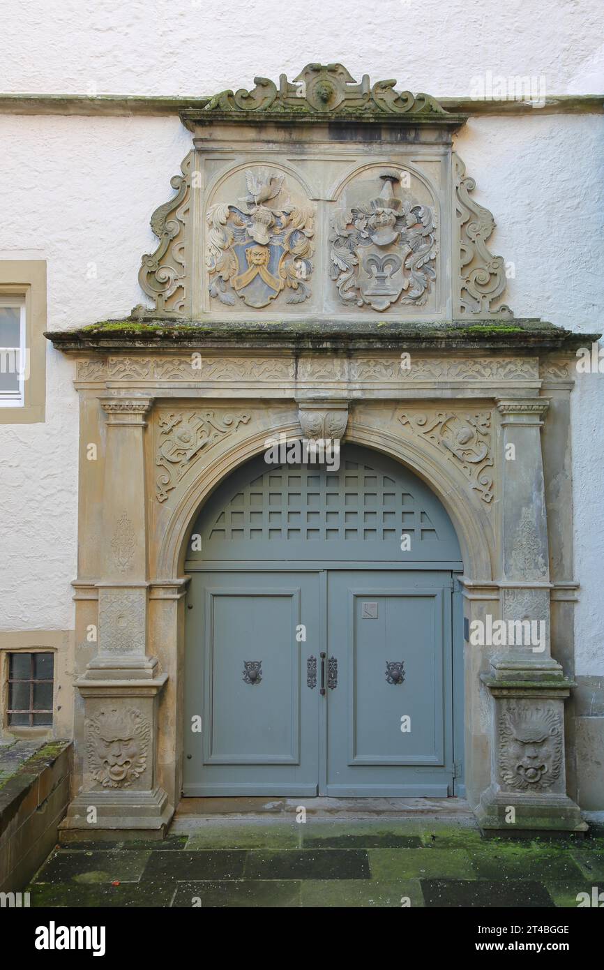 Gate with coat of arms in the courtyard of the Romanesque Comburg ...