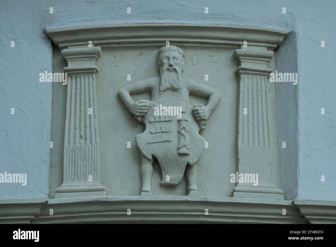 Figure with town coat of arms, shield and year, 1602, pilaster ...