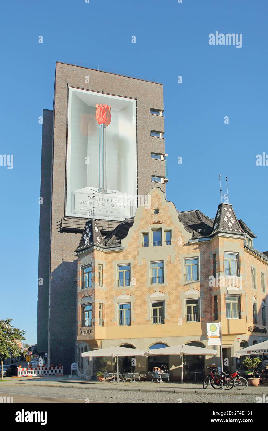High-rise building with mural, red rose, oversize, large, street art ...