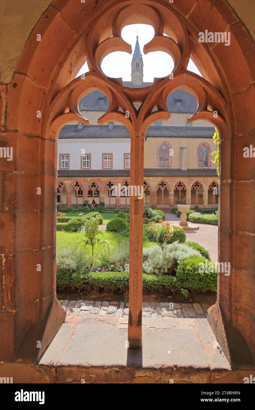 View through window to the inner courtyard with cloister of the ...