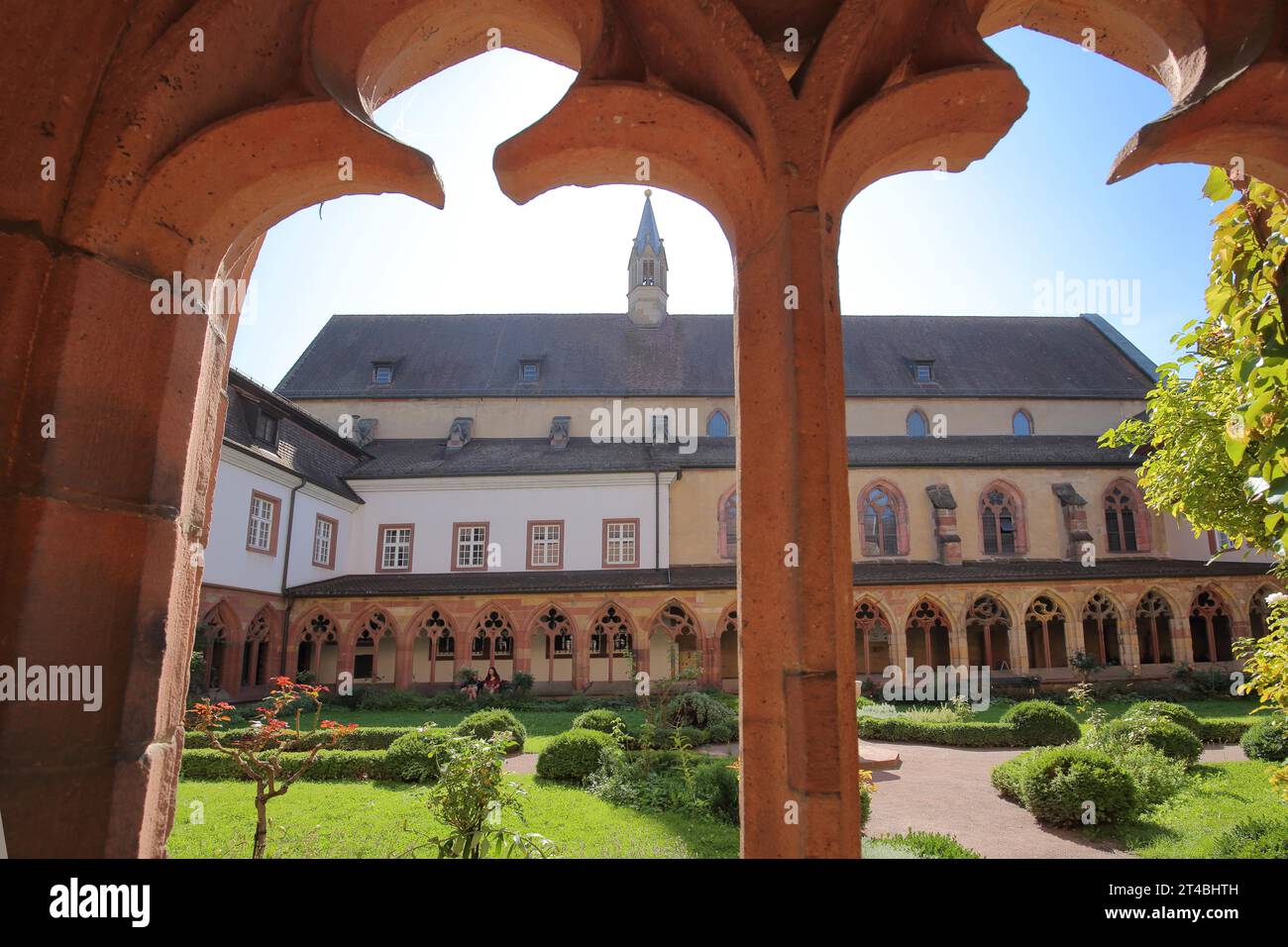 View through window to the inner courtyard with cloister of the ...