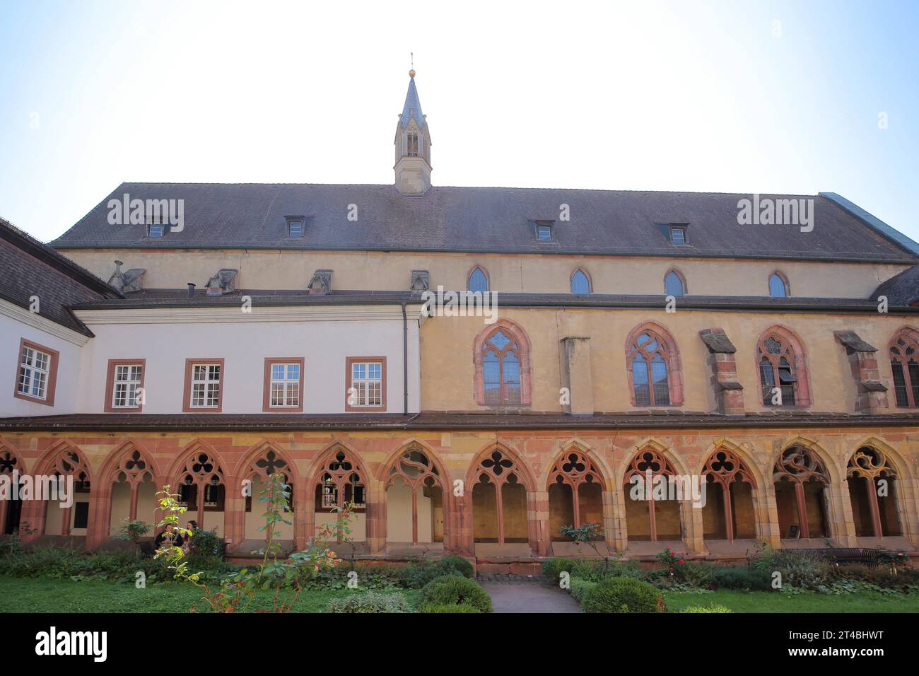 Inner courtyard with cloister and tower spire of Augustinian monastery ...