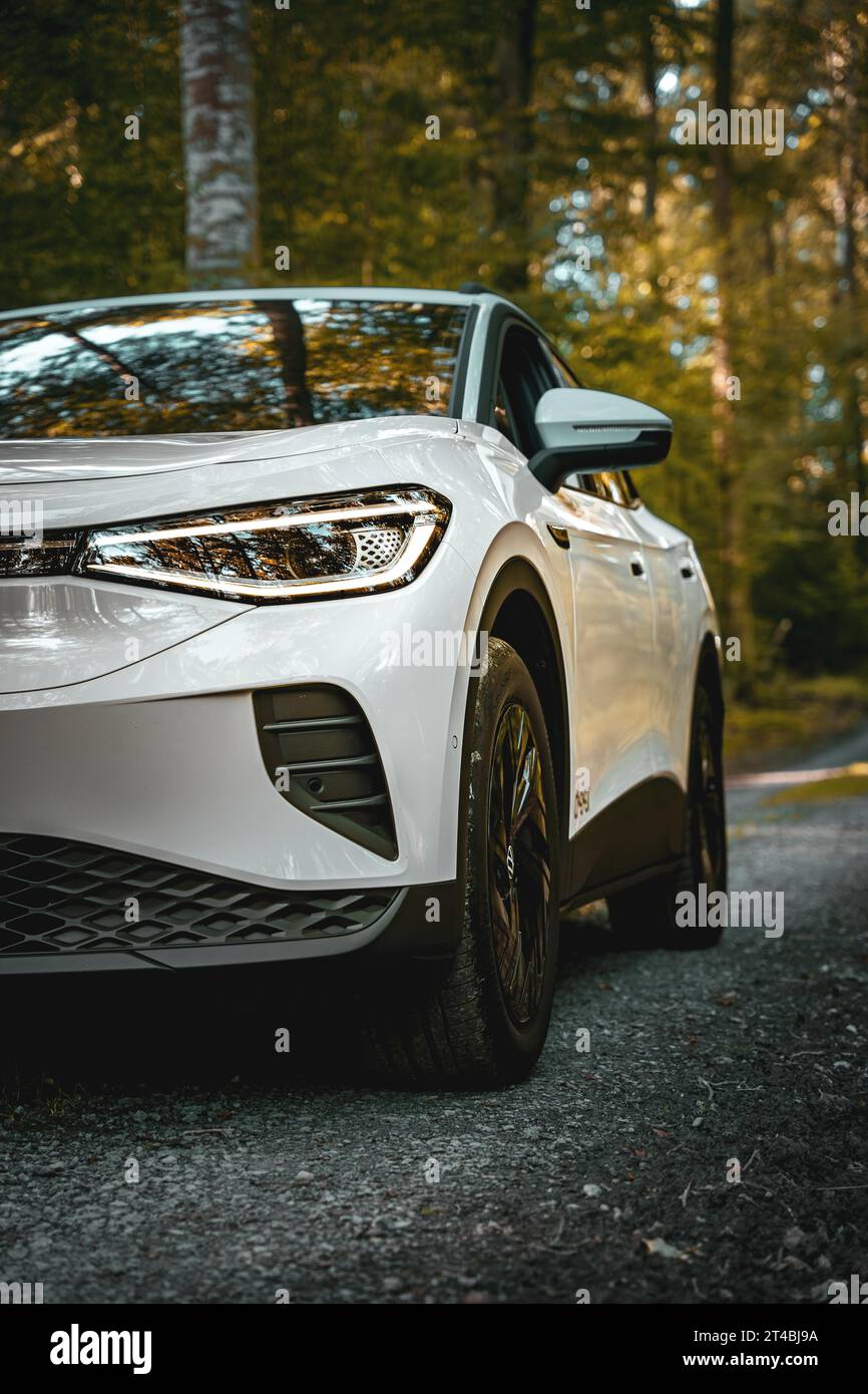 Electric car white VW ID4 in the forest, Black Forest, Gechingen ...