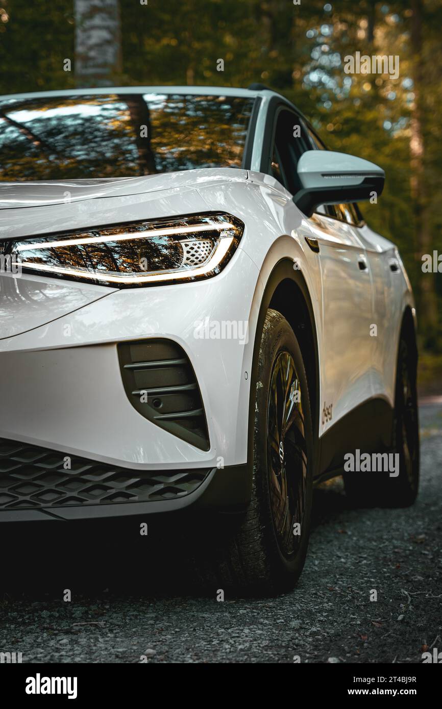 Electric car white VW ID4 in the forest, Black Forest, Gechingen ...
