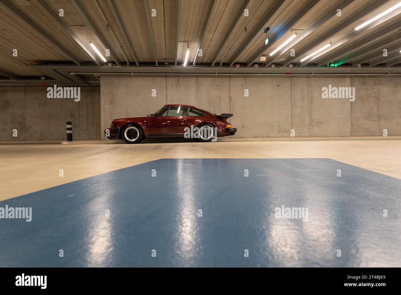 Wine-red Porsche in an underground car park, Copenhagen, Denmark Stock ...