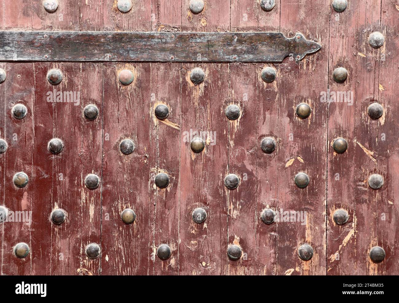 Detail of old wooden gate leaf part. Ancient wood door with metal ...