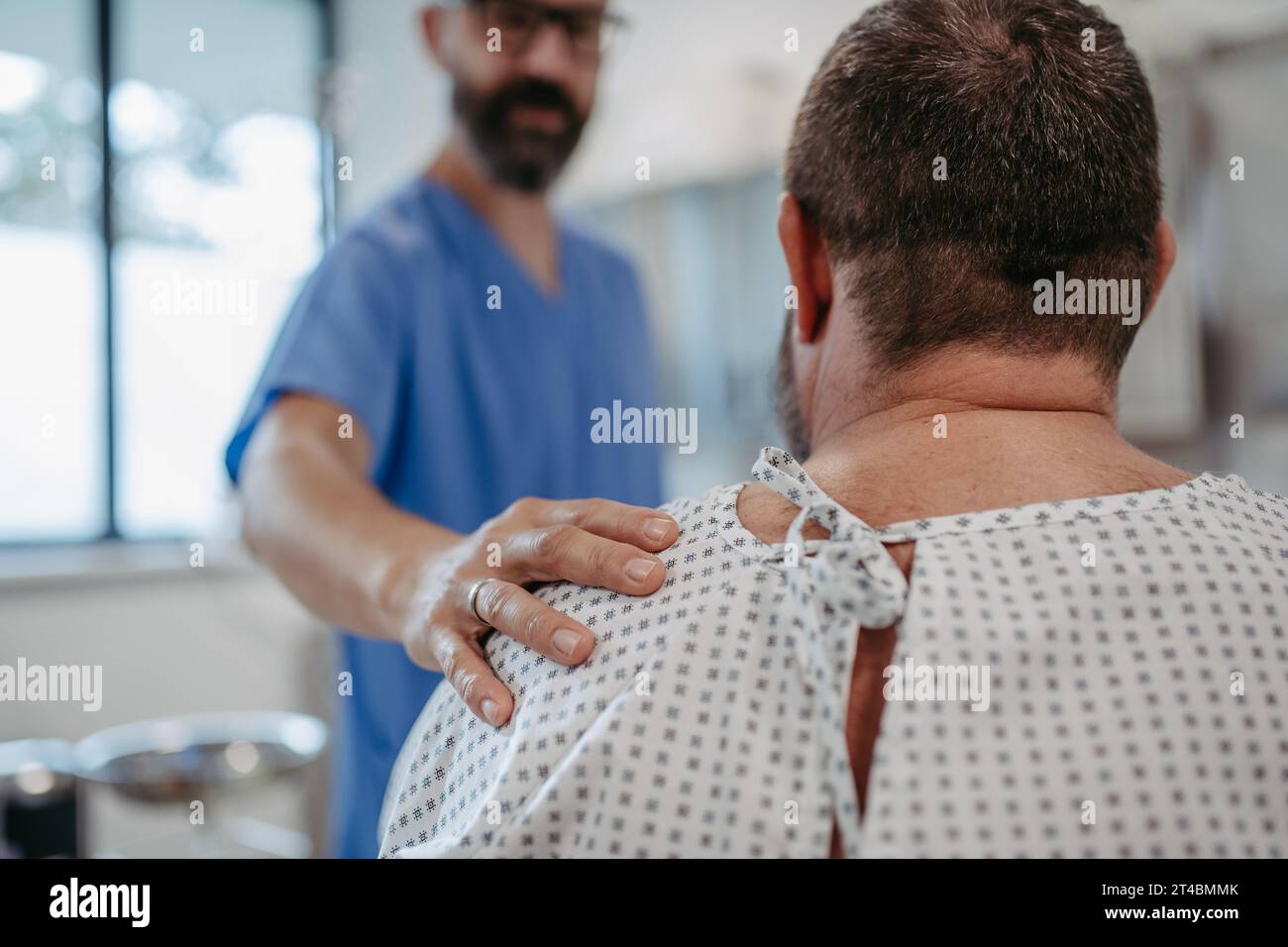 Supportive doctor soothing a worried overweight patient, discussing ...