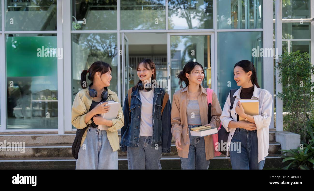 Happy young student chat with each other after class. Guy and girls ...
