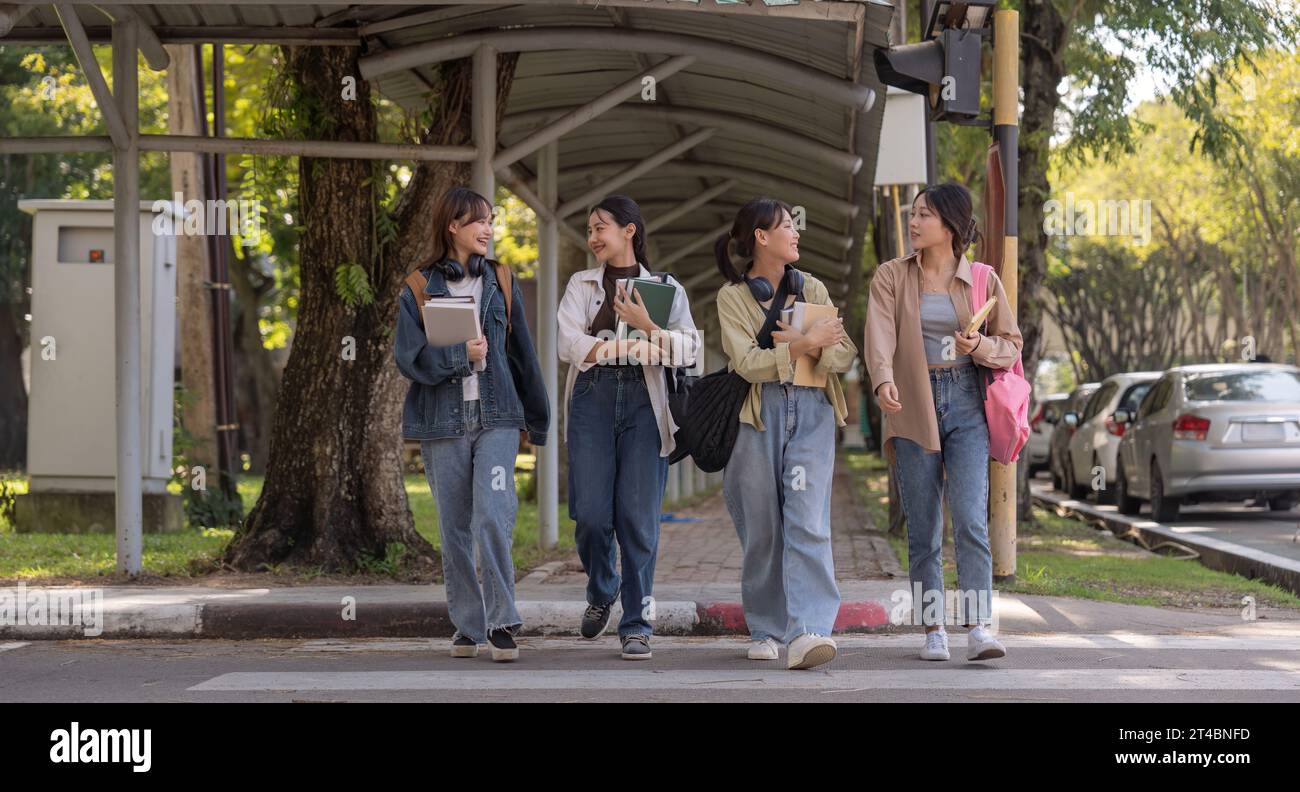 Happy young student chat with each other after class. Guy and girls ...