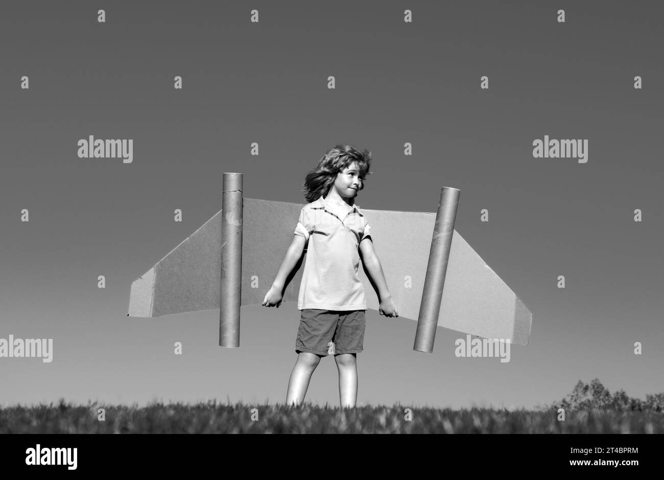 Kid imagination, child pilot with paper wings having fun at outdoor ...