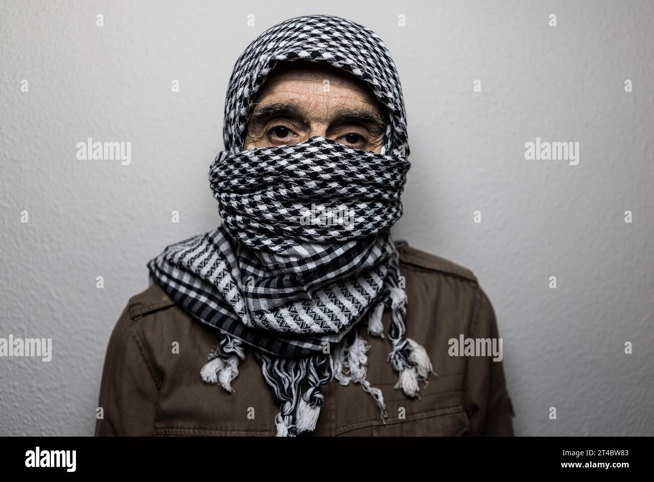 Portrait of military man wearing Palestinian headscarf or shemagh ...