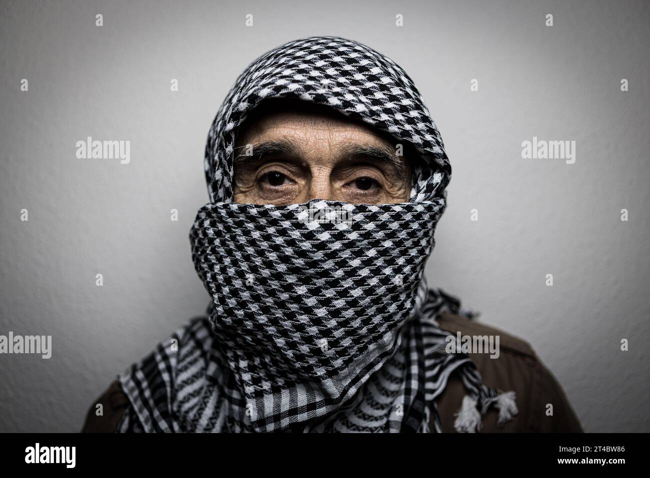 Portrait of military man wearing Palestinian headscarf or shemagh ...
