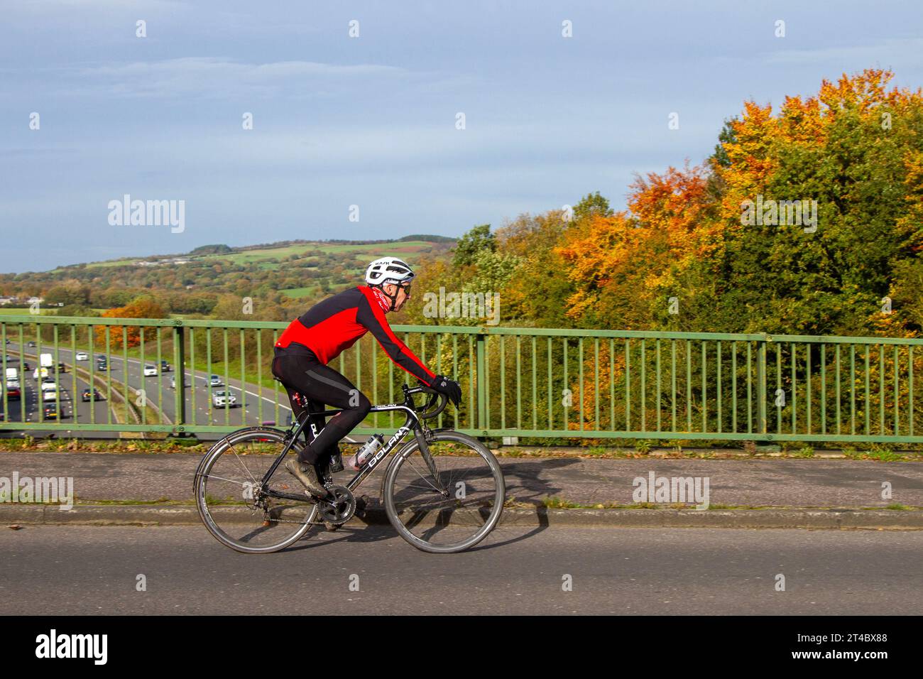 Male cyclist riding Dolan sports road bike, blurred, low shutter speed ...
