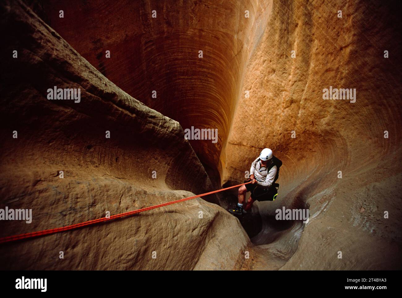 Man rappelling rock formation adventure hi-res stock photography and ...