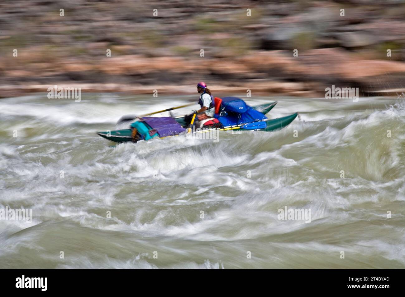 man rowing a raft down river, Grand Canyon, Arizona (blurred motion ...