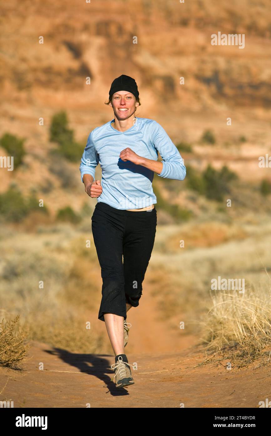 Woman running, Moab, Utah Stock Photo - Alamy