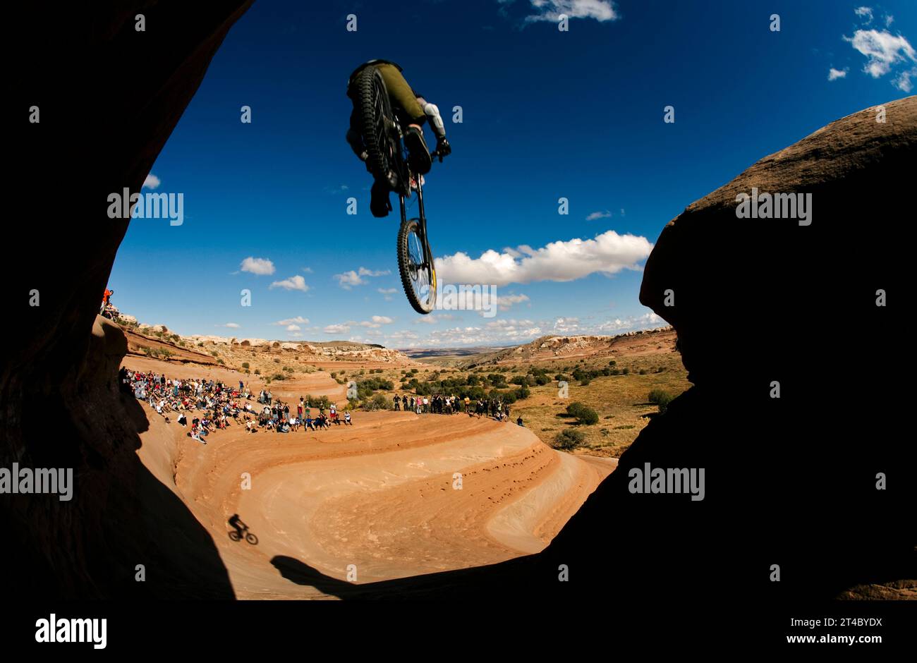 Mountain biker in mid air jumping of cliff, Moab, Utah Stock Photo - Alamy