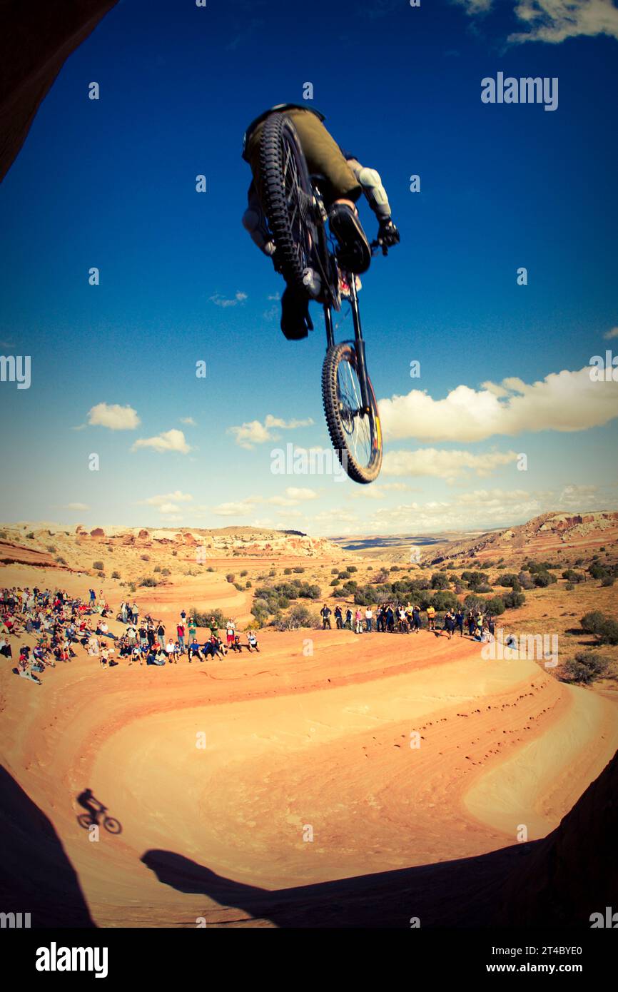Mountain biker in mid air jumping of cliff, Moab, Utah Stock Photo - Alamy