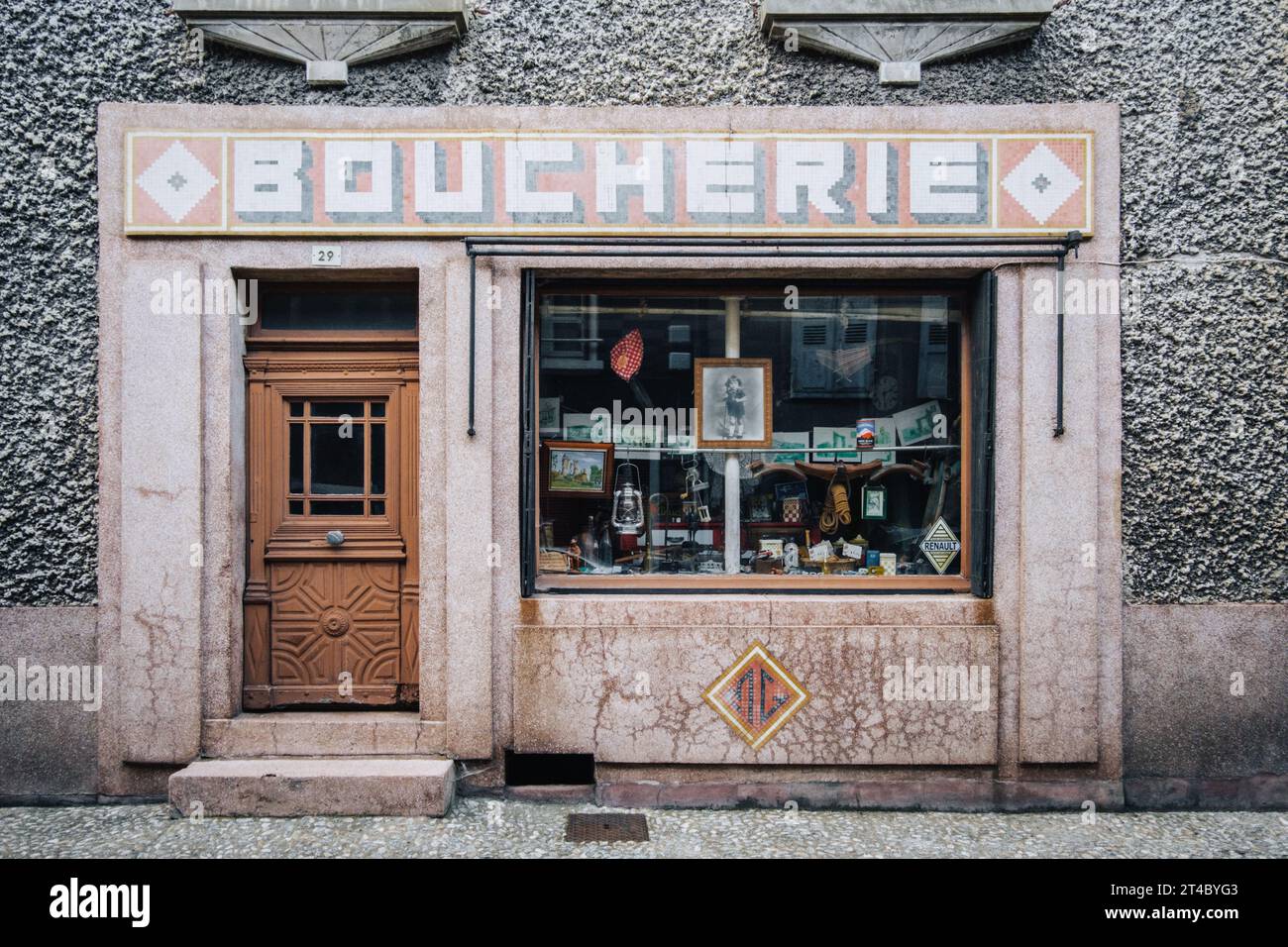 Traditionnal wooden storefront of a butcher in a small French village ...