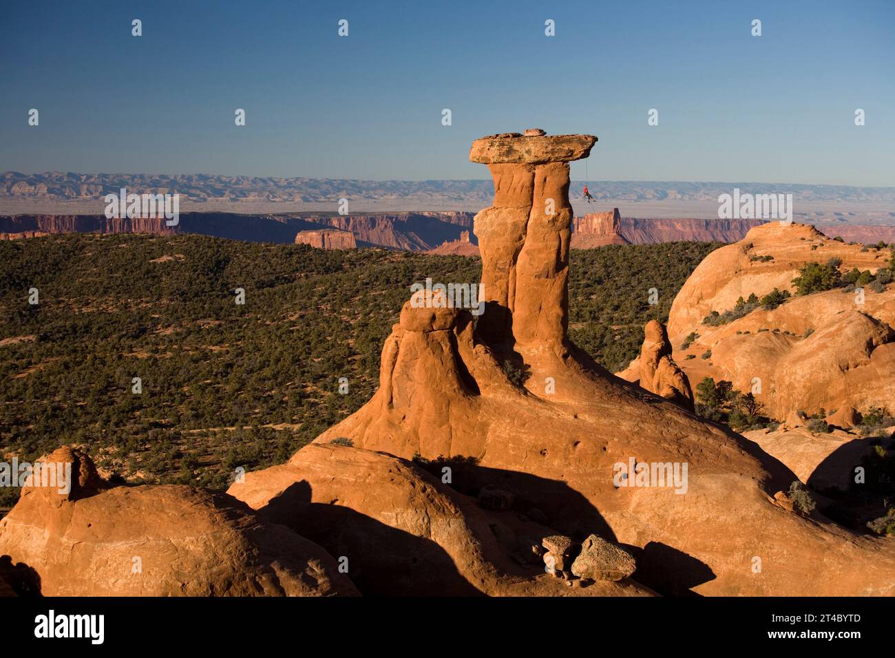 man rappelling off of rock spire, Moab, Utah Stock Photo - Alamy