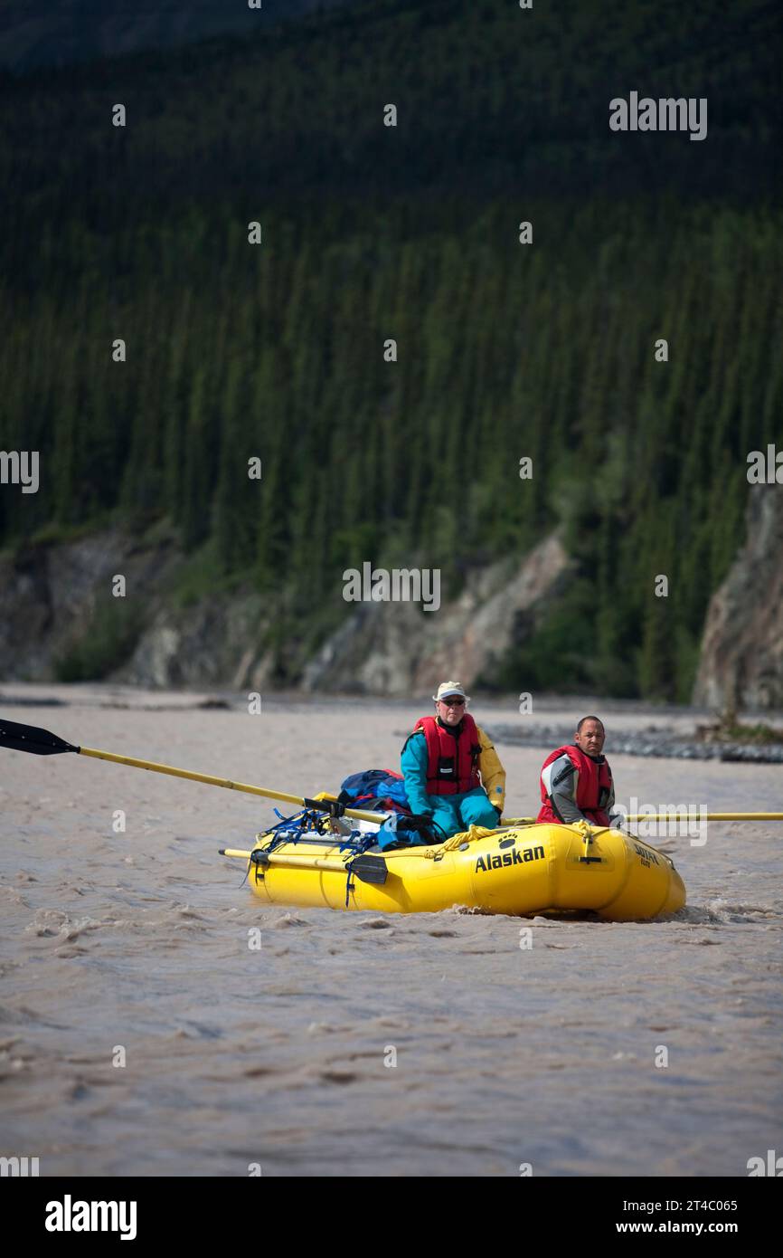 Two men floating down the Jacksina river, Wrangell-St. Elias National ...