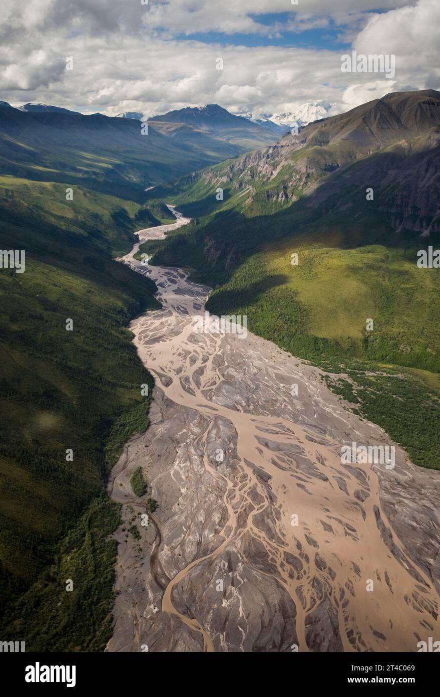 Ariel view of braided river flowing through valley in the Wrangell-St ...