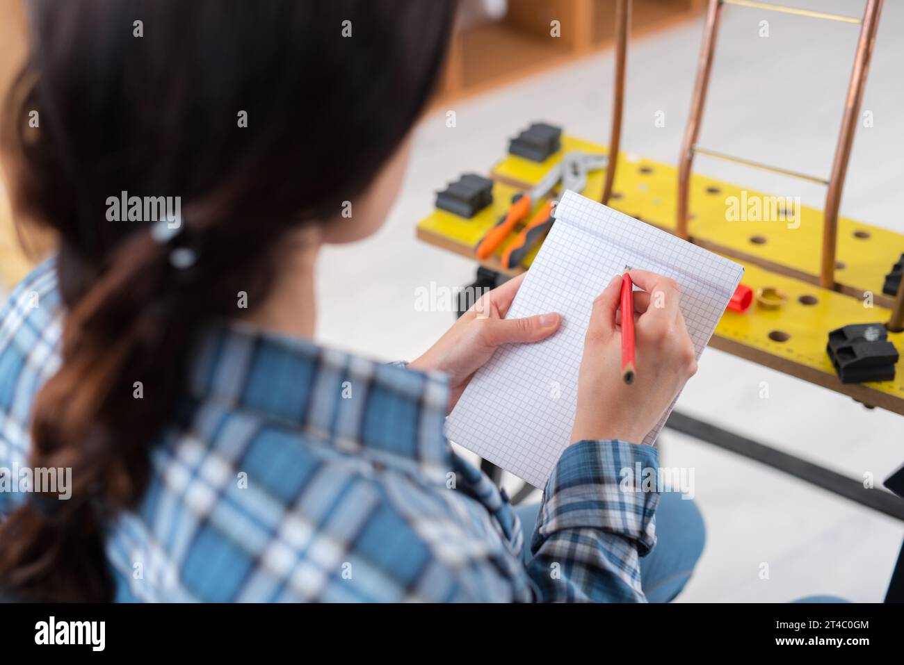 Female architect writing note in hi-res stock photography and images ...