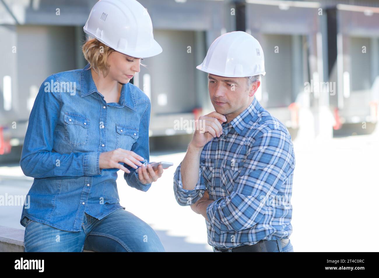 the factory workers working outdoors Stock Photo - Alamy